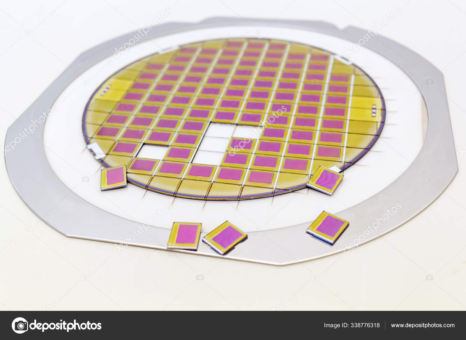 Silicon wafer with microchips fixed in a holder with a steel frame ... Silicon wafer with microchips fixed in a holder with a steel frame ...