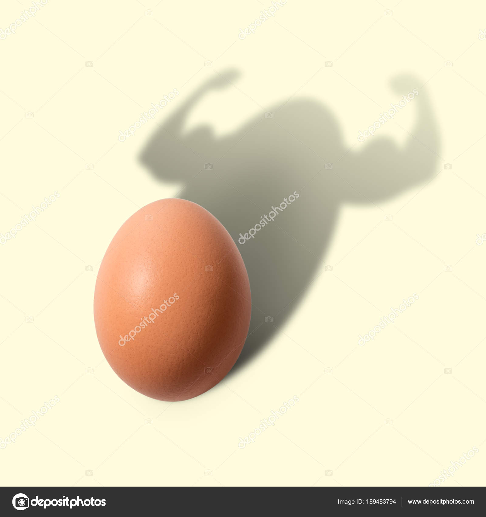 The egg casts a shadow in the form of a bodybuilder. Stock Photo by ...