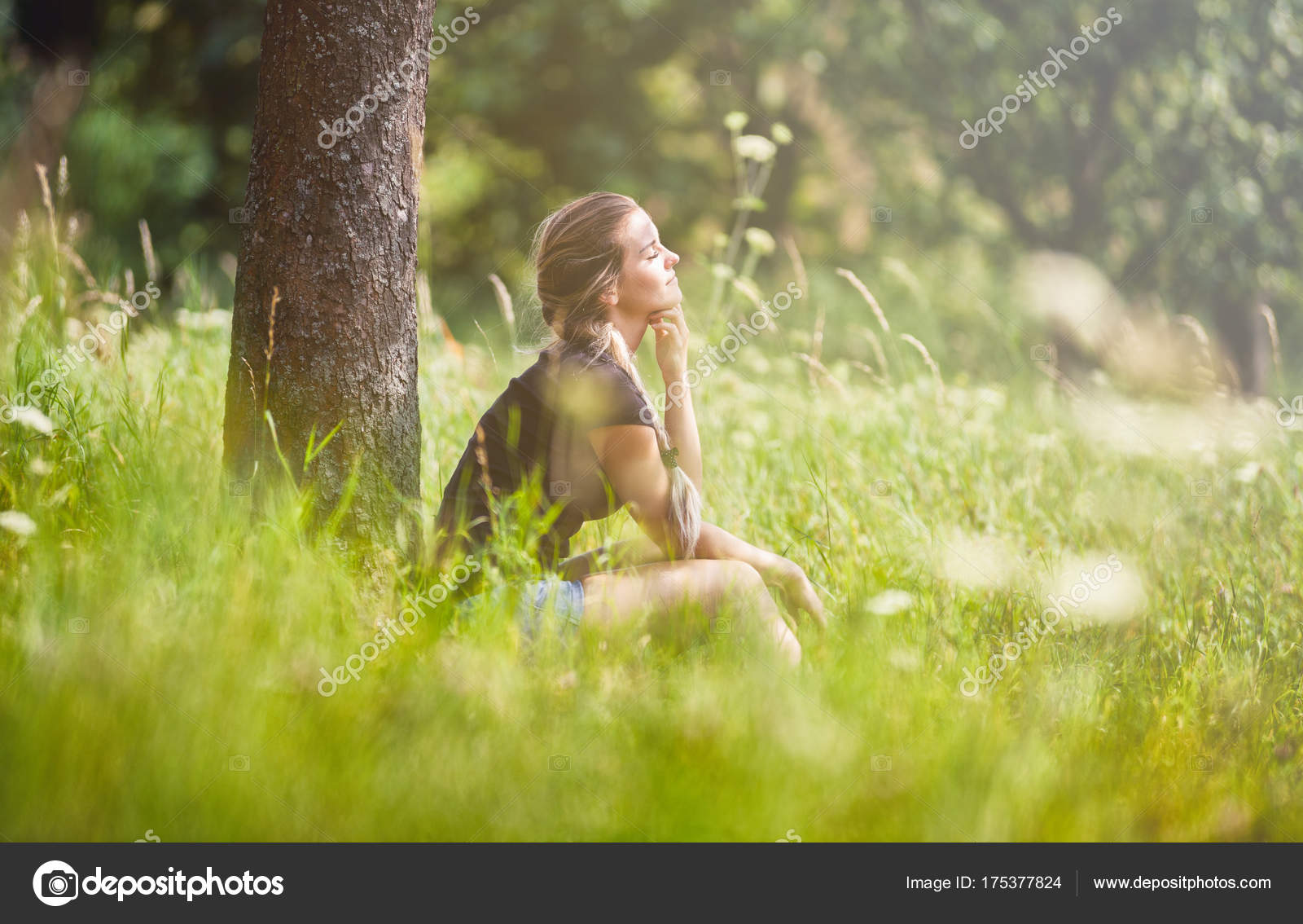 A Girl Sitting Alone Under A Tree Girl Is Sitting Under Tree In Forest