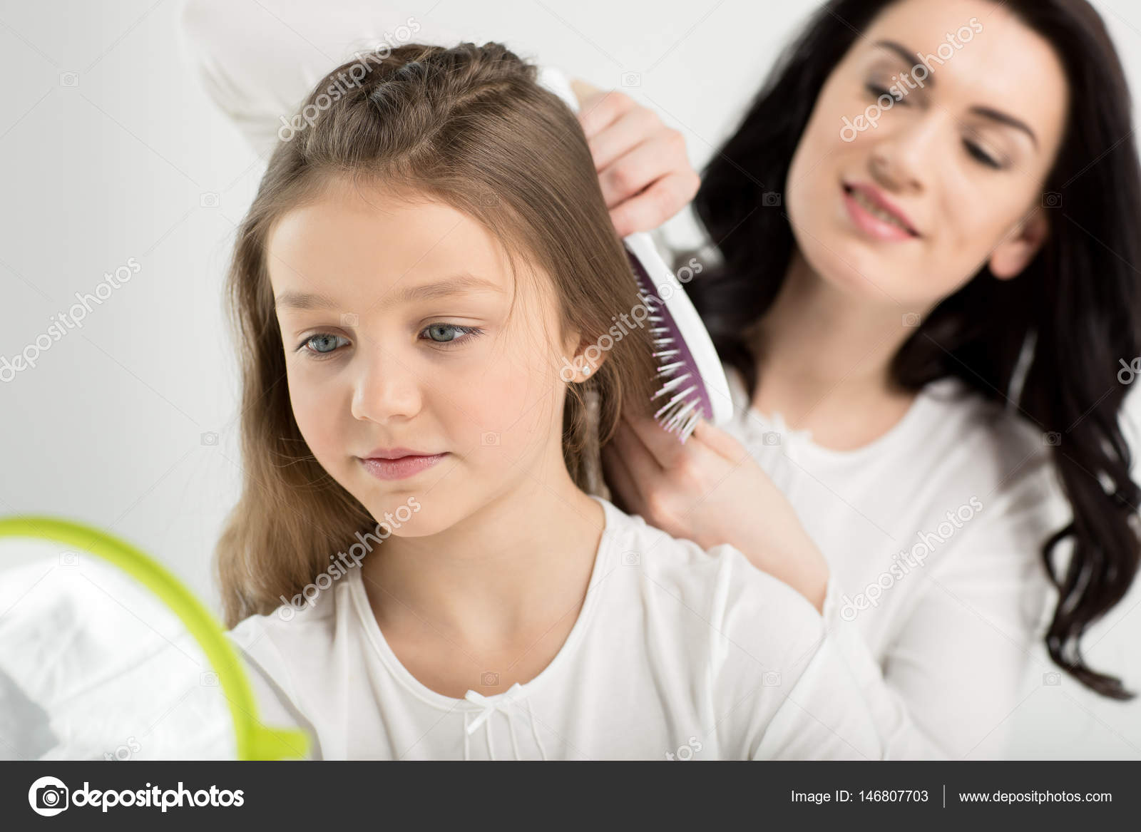 Mother combing hair of daughter — Stock Photo © YuraSokolov #146807703 Mother combing hair of daughter — Stock Photo © YuraSokolov #146807703