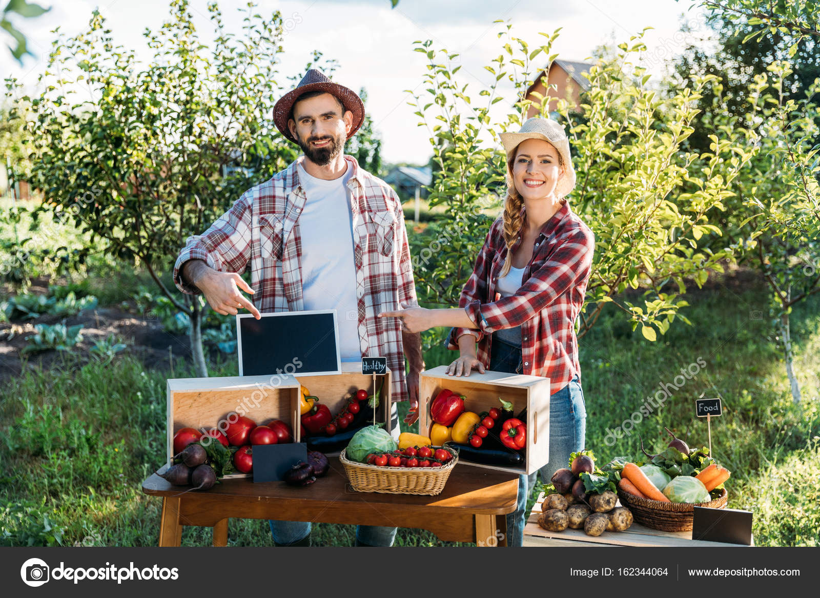 Farmers selling vegetables — Stock Photo © SashaKhalabuzar #162344064