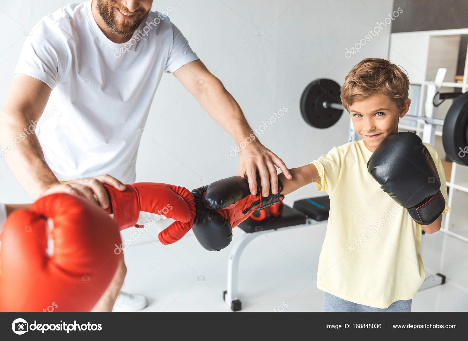 Trainer and boys in boxing gloves — Stock Photo © SashaKhalabuzar ...