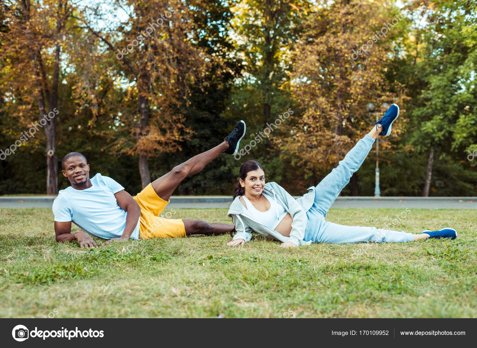 Multicultural couple training at park — Stock Photo © SashaKhalabuzar ... Multicultural couple training at park — Stock Photo © SashaKhalabuzar ...