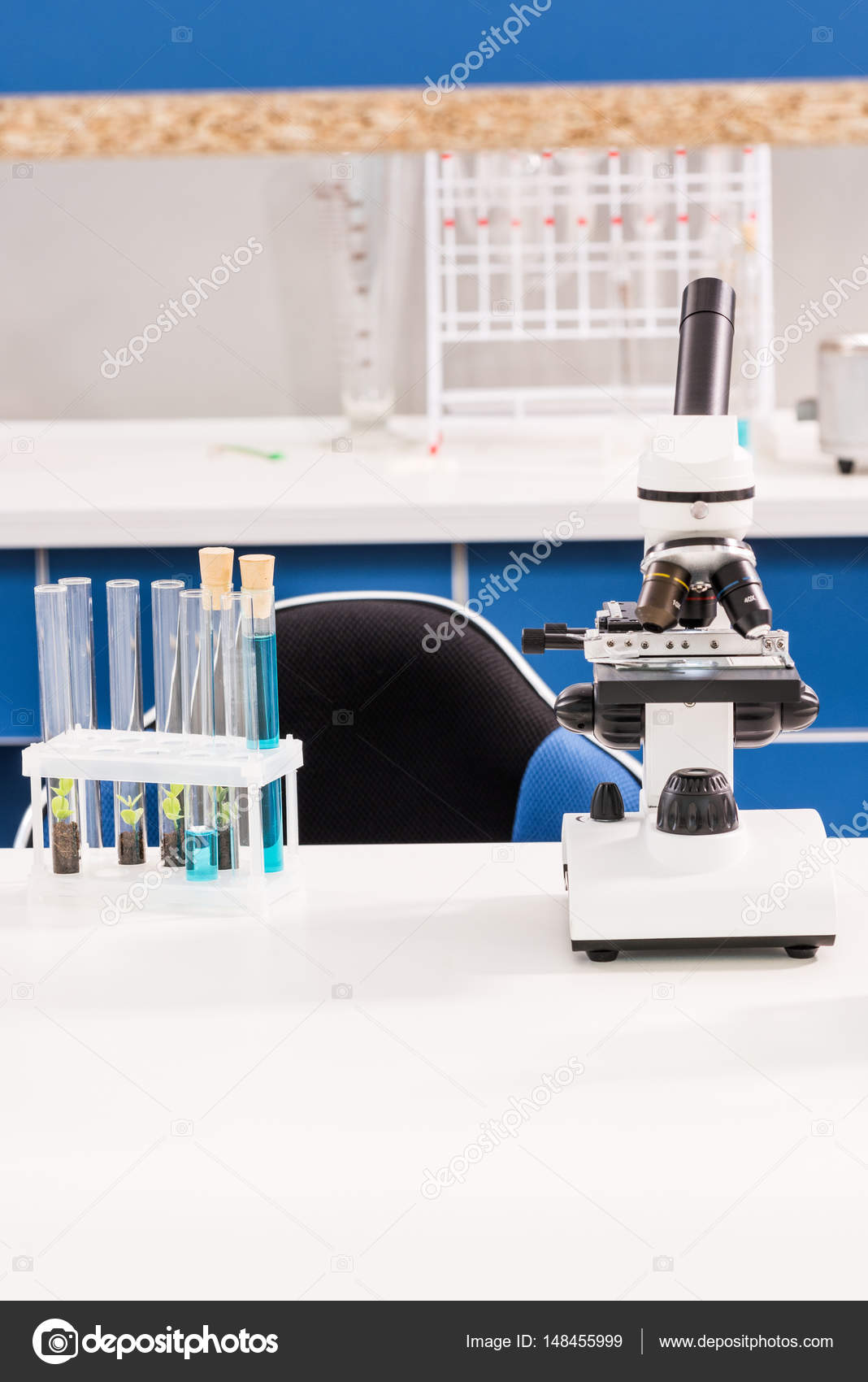 Tubes and microscope in laboratory Stock Photo by ©DimaBaranow 148455999
