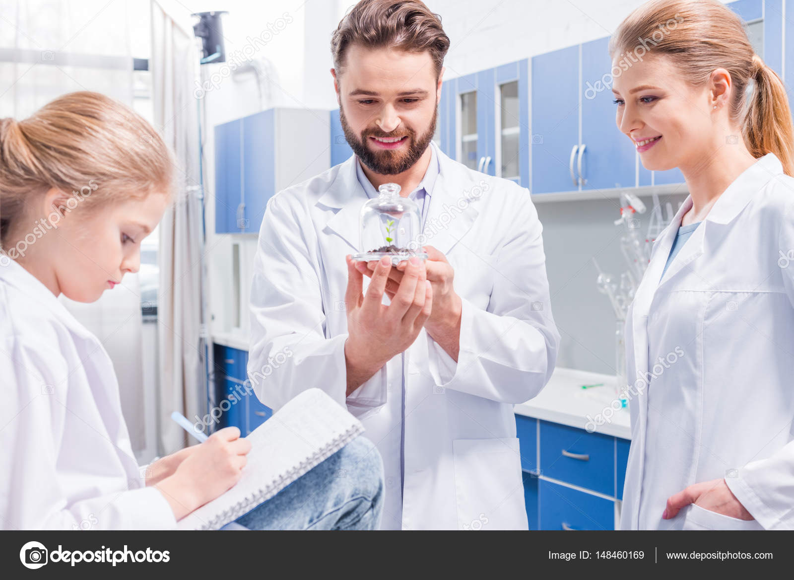 Teachers and student in lab — Stock Photo © DimaBaranow #148460169