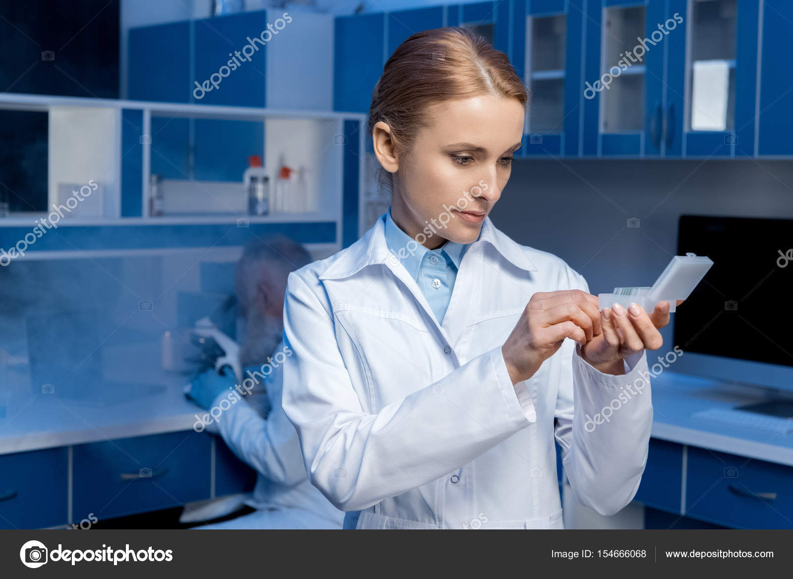 Laboratory technician looking at samples at laboratory — Stock Photo ...