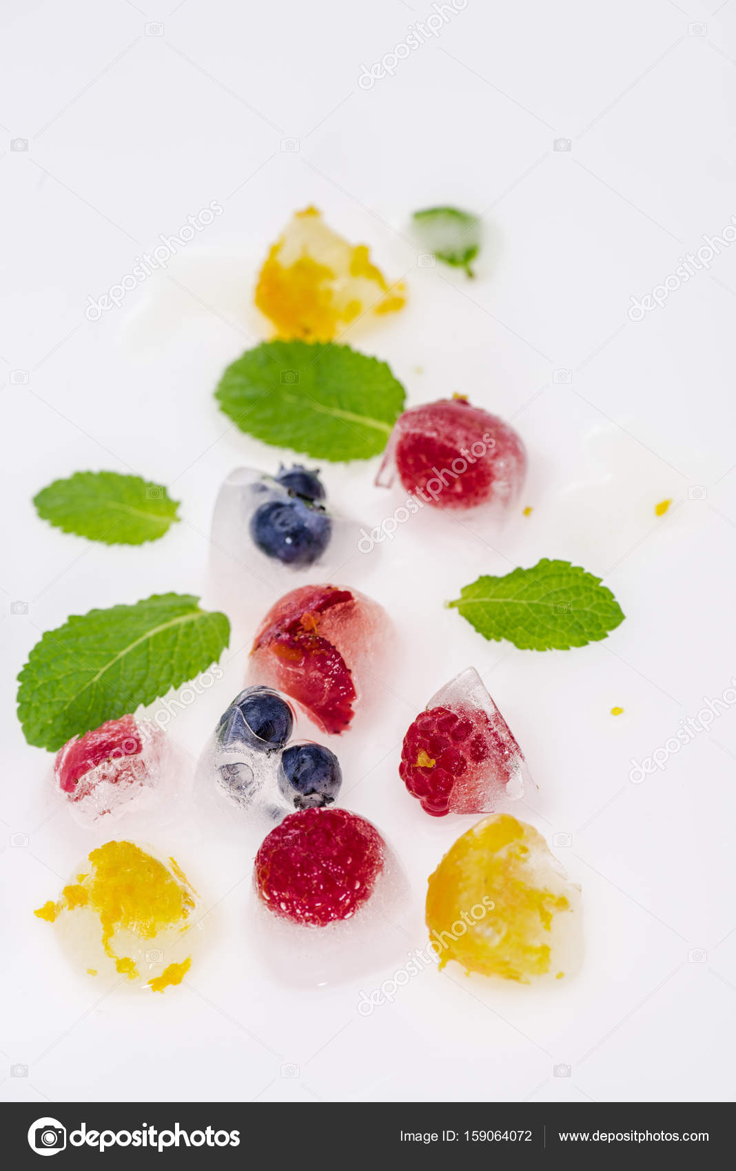 Berries in ice cubes — Stock Photo © DimaBaranow #159064072