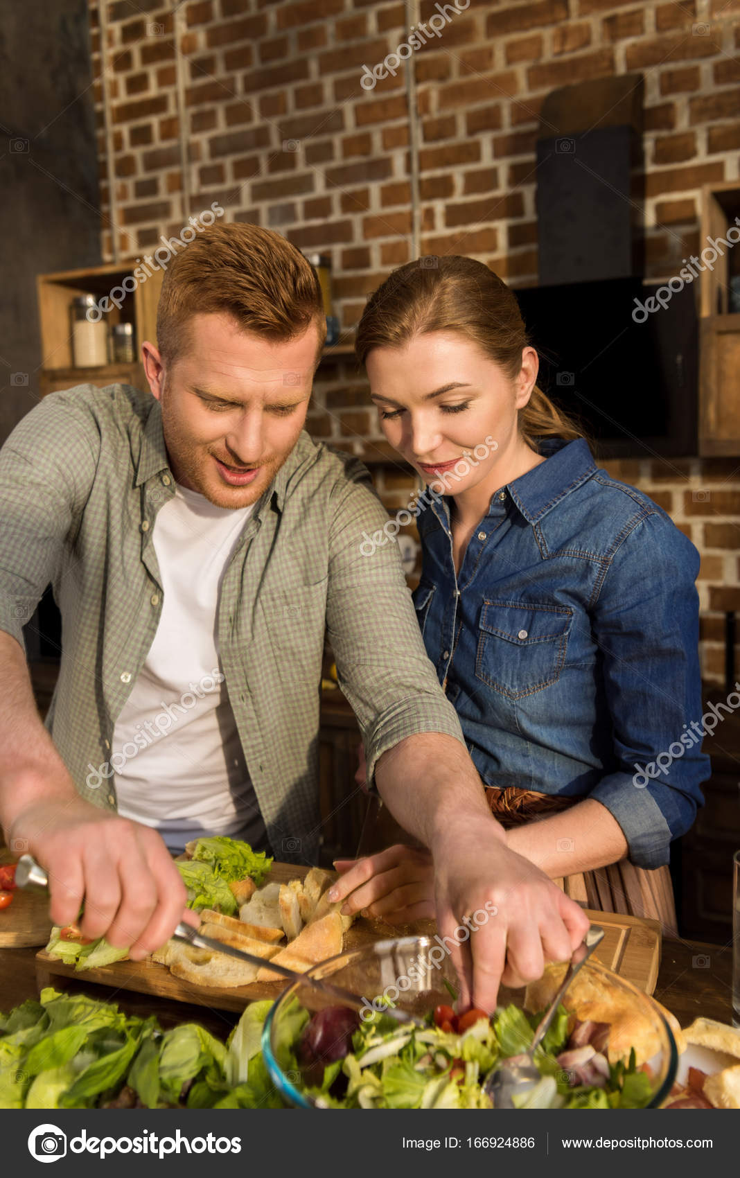 Couple cooking dinner together — Stock Photo © DimaBaranow #166924886