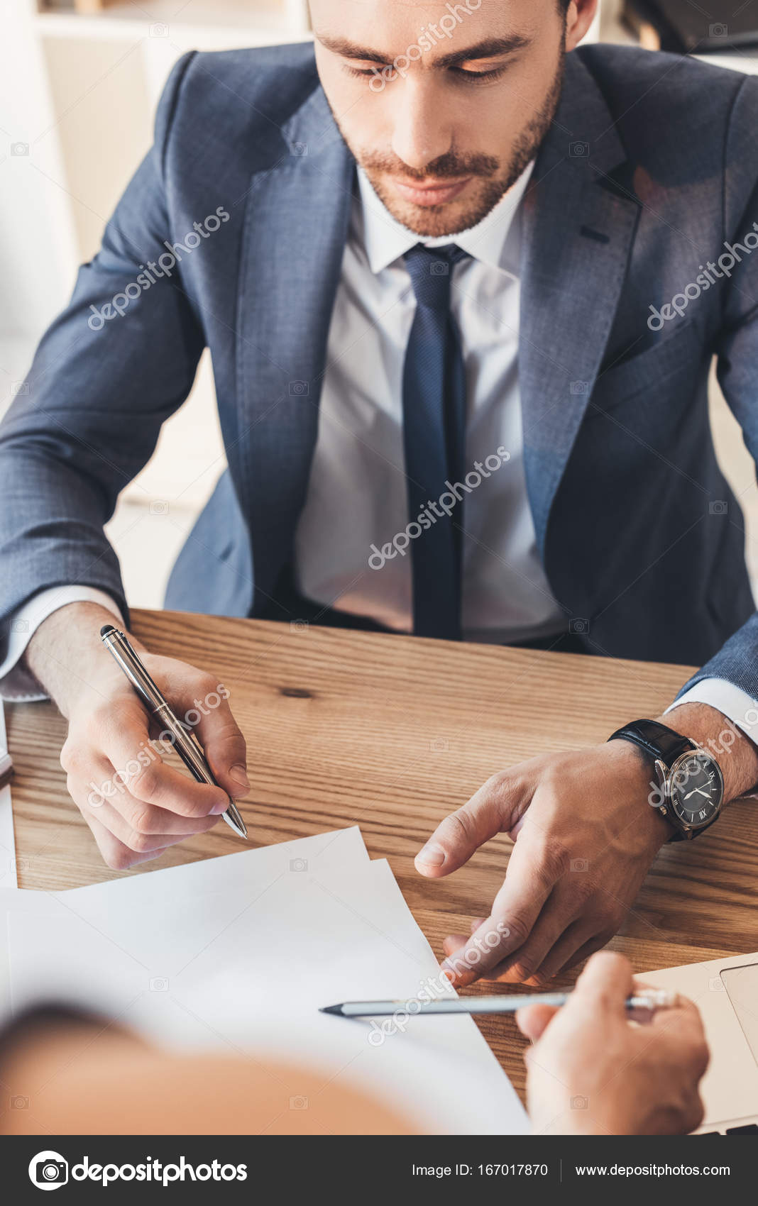 Businessman signing paperwork — Stock Photo © DimaBaranow #167017870 Businessman signing paperwork — Stock Photo © DimaBaranow #167017870