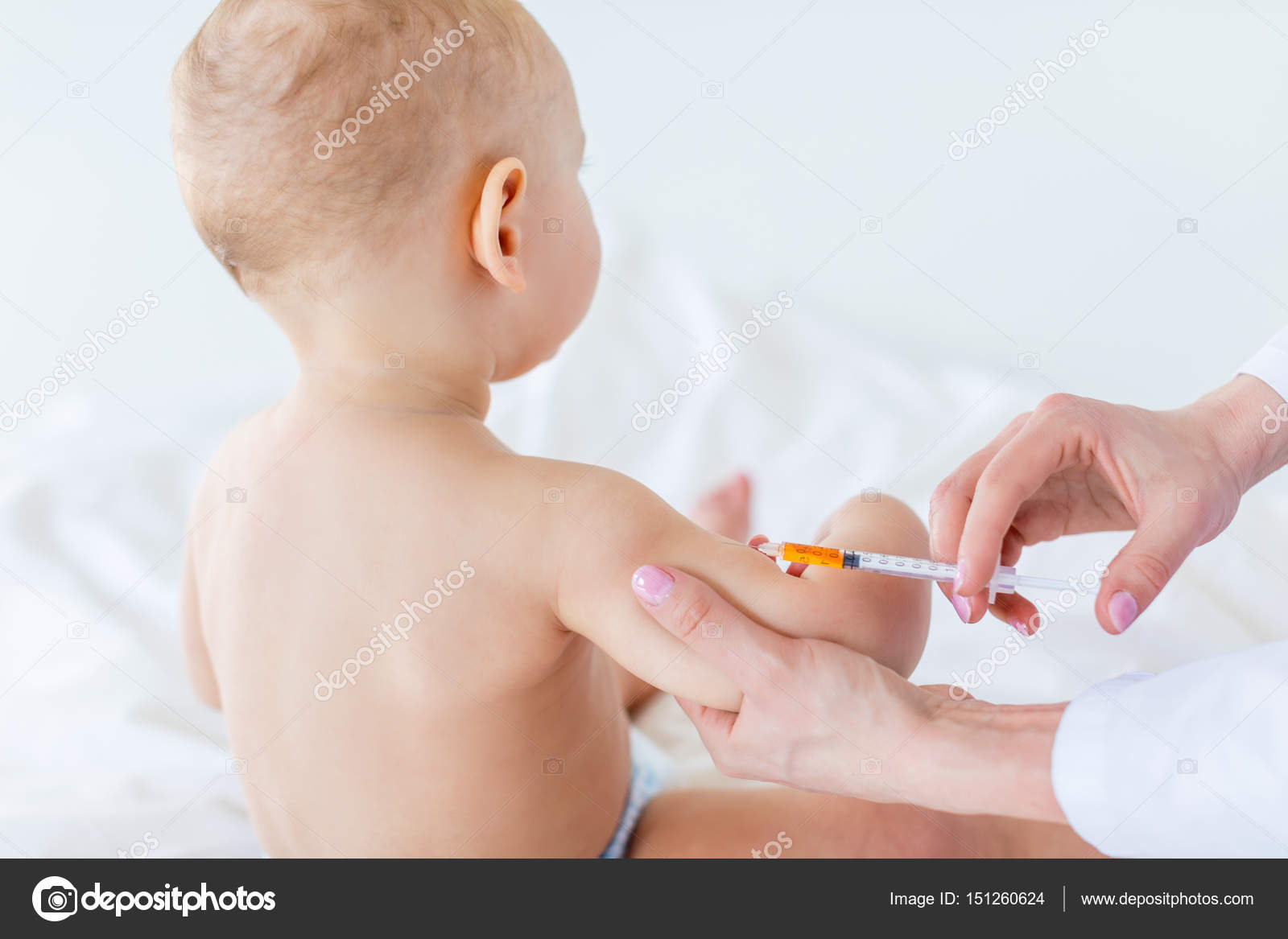 Baby boy at vaccination — Stock Photo © LenaMiloslavskaya #151260624