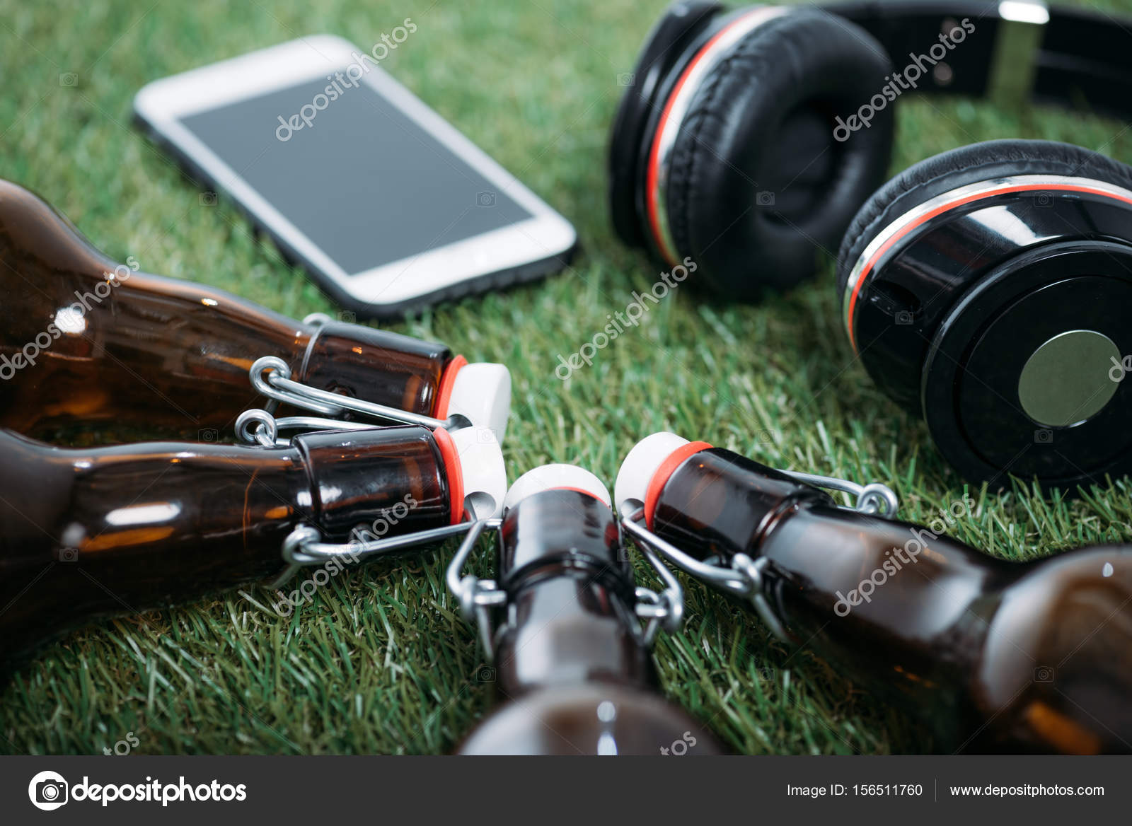Beer bottles with smartphone and headphones — Stock Photo © AlexLipa ...