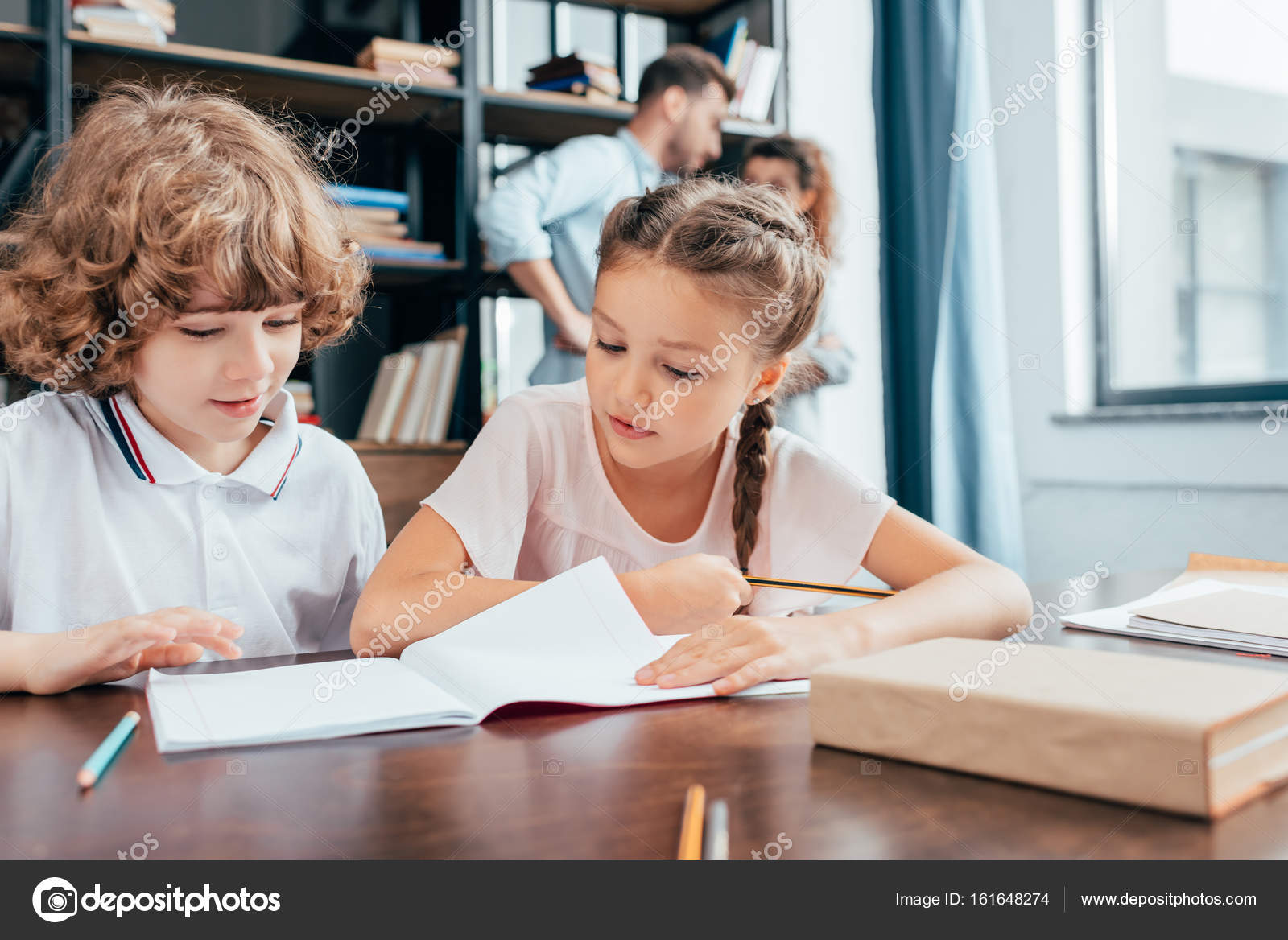 Kids doing homework together — Stock Photo © AlexLipa #161648274