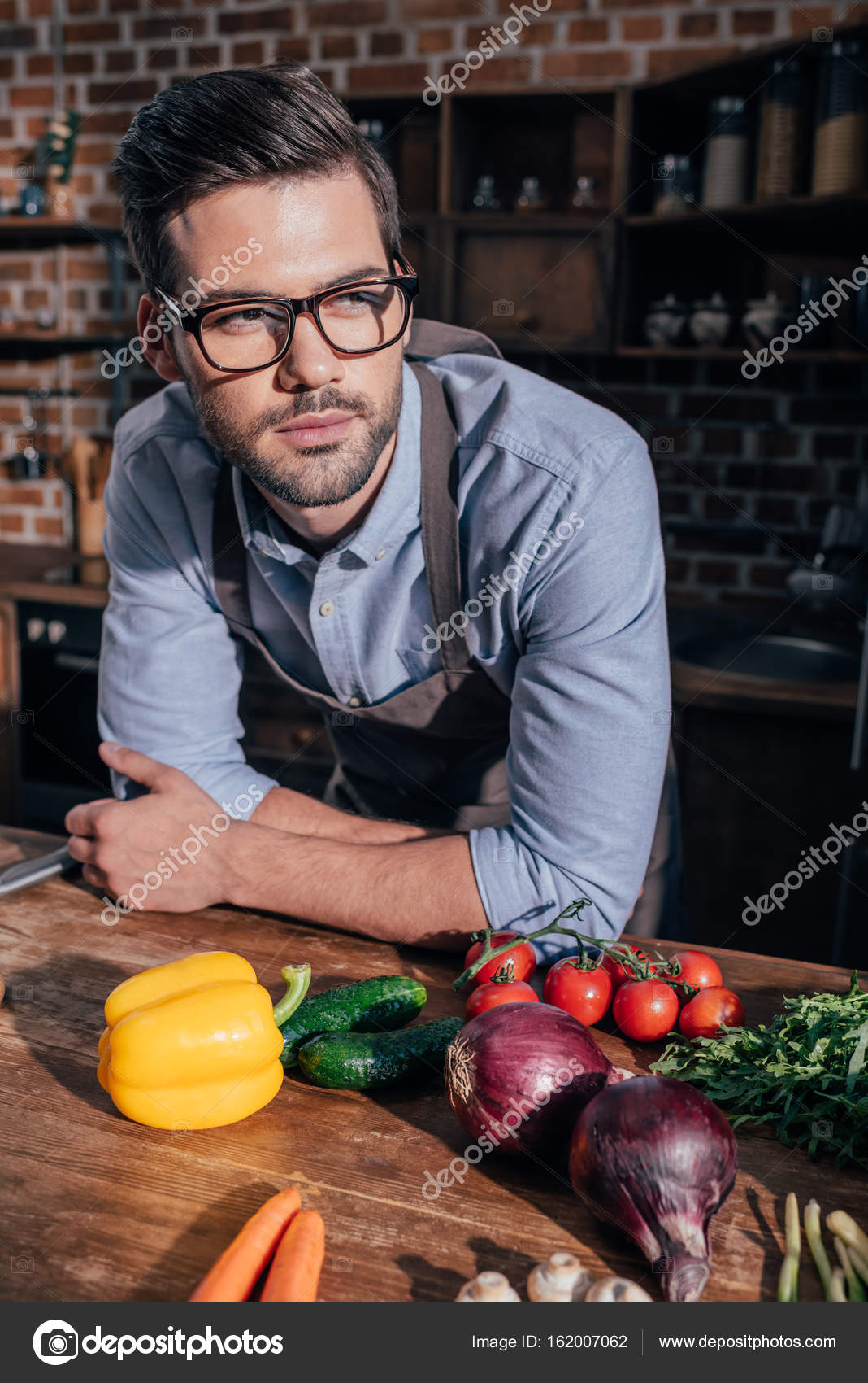 Thoughtful young man at kitchen — Stock Photo © AlexLipa #162007062