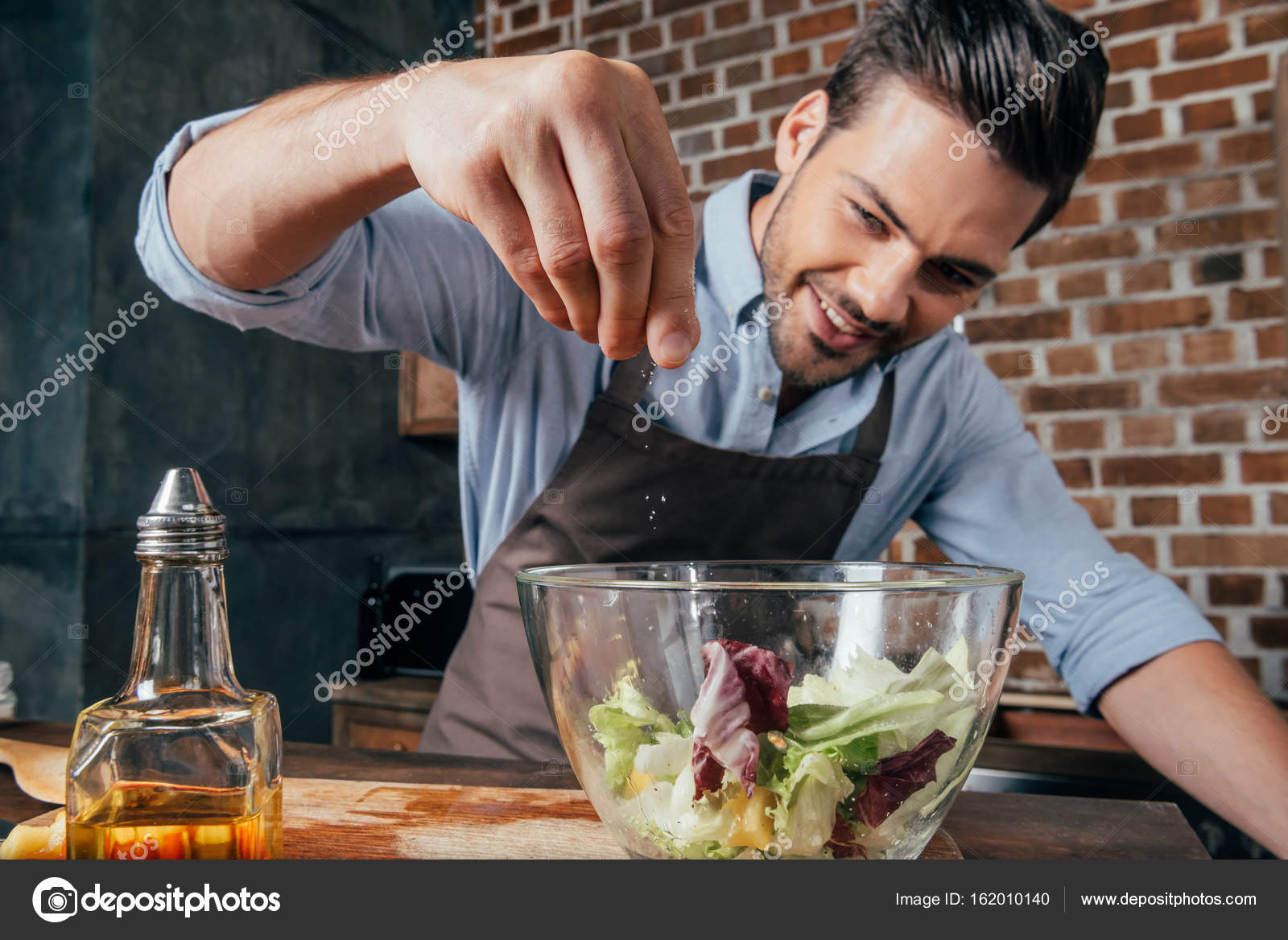 Man making salad — Stock Photo © AlexLipa #162010140