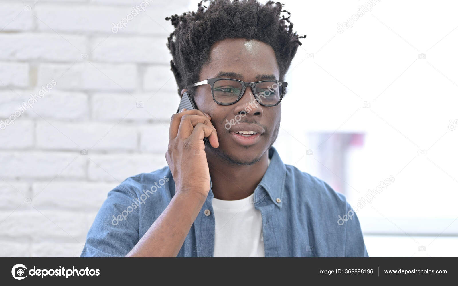 Young African Man Talking on Smartphone — Stock Photo © mustang.marshal ...