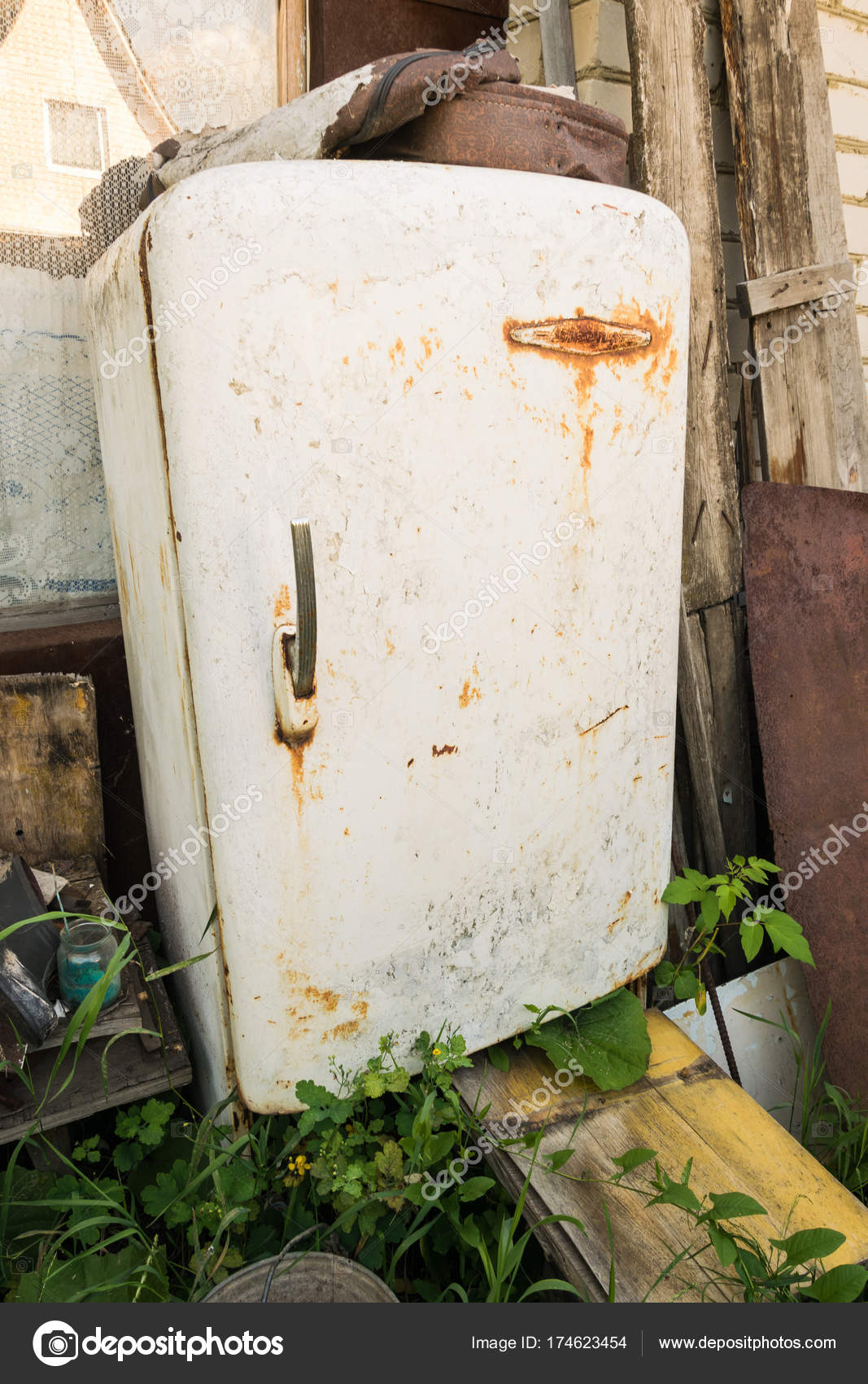 An antique abandoned rusty refrigerator. – Stock Editorial Photo ...