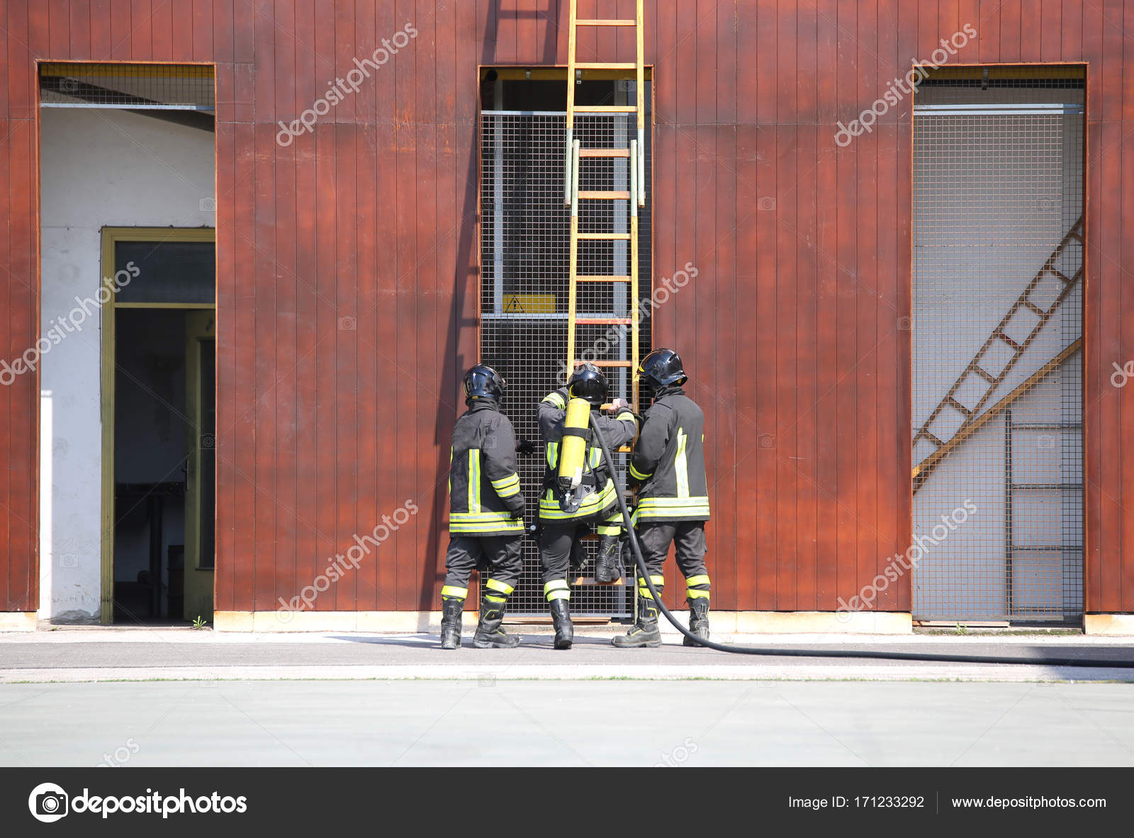 Three firefighters in the fire brigade — Stock Photo © ChiccoDodiFC ...