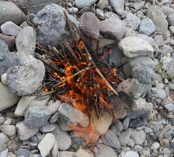 bonfire made with stones arranged to circle - Stock Image - Everypixel