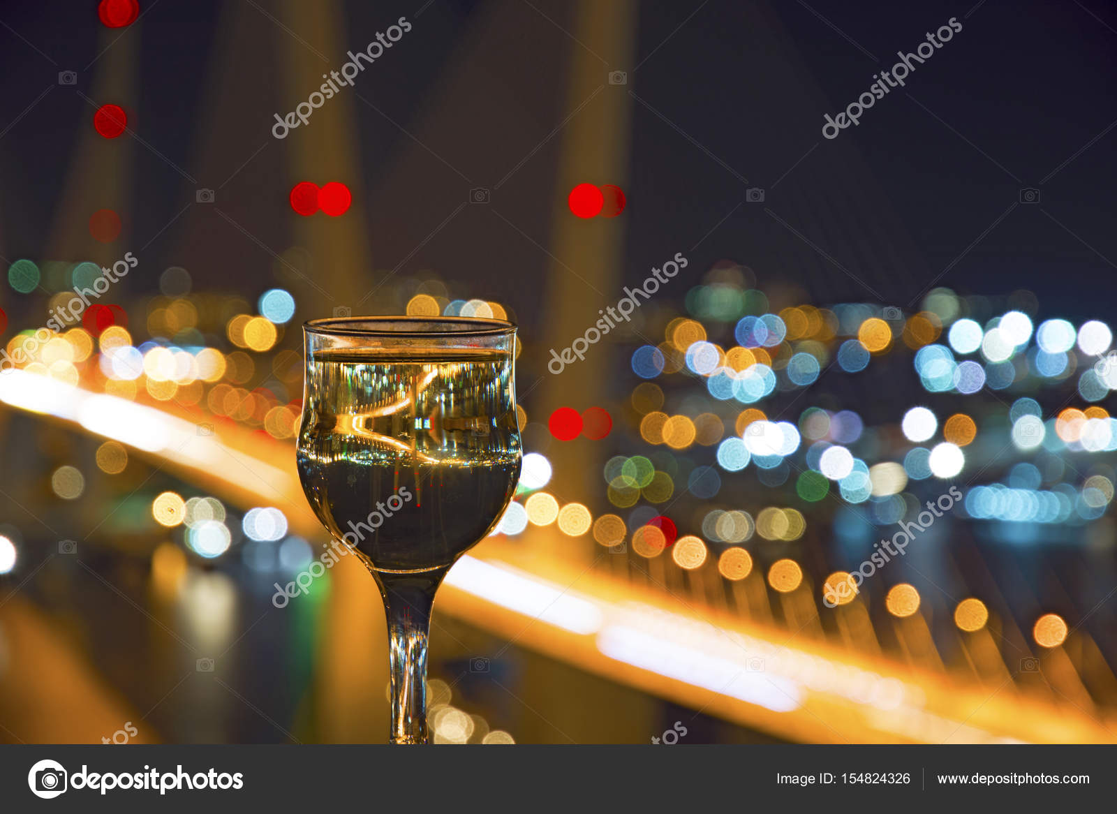 View the city at night, the bridge across the Bay at night, glasses ...