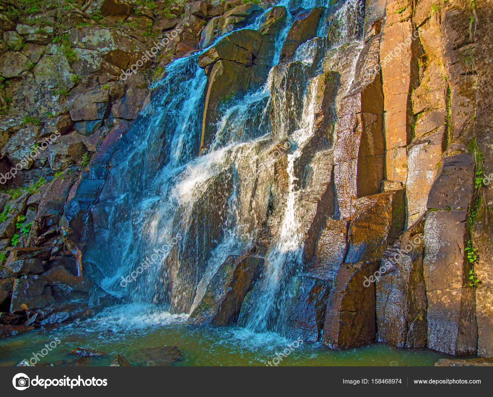 A beautiful waterfall in the forest. Wildlife, waterfalls in a deserted ...