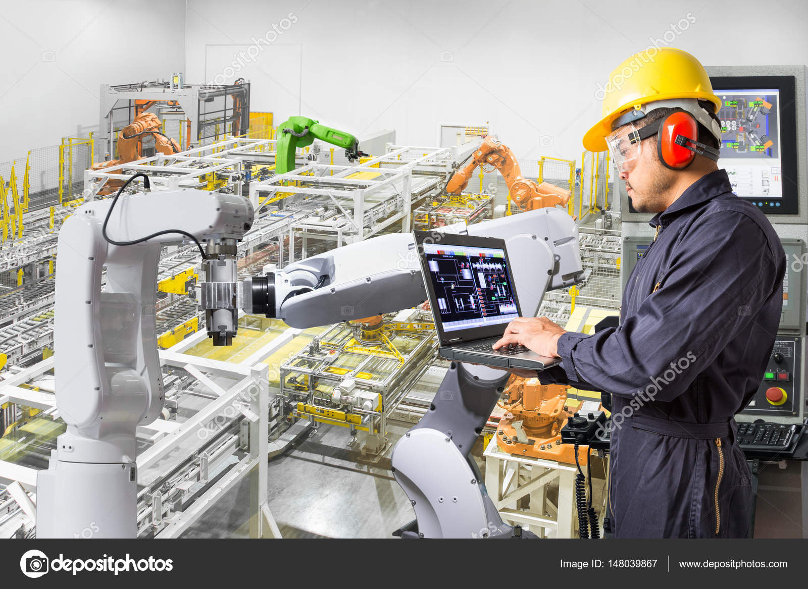 Engineer using laptop computer for maintenance automatic robotic — Stock Photo © Kinwun #148039867