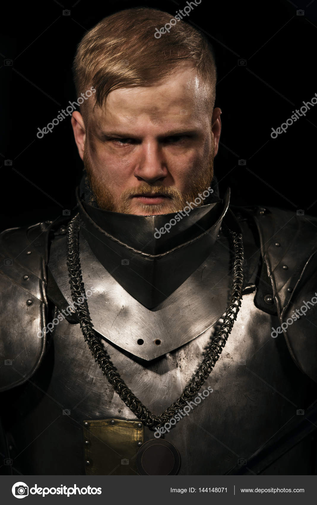 Knight in armour after battle on the black background — Stock Photo ...