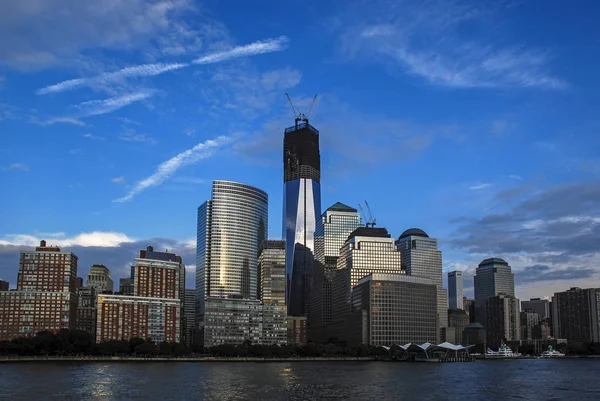 view on Manhattan from Hudson river at beautiful sunset, Freedom Tower ...
