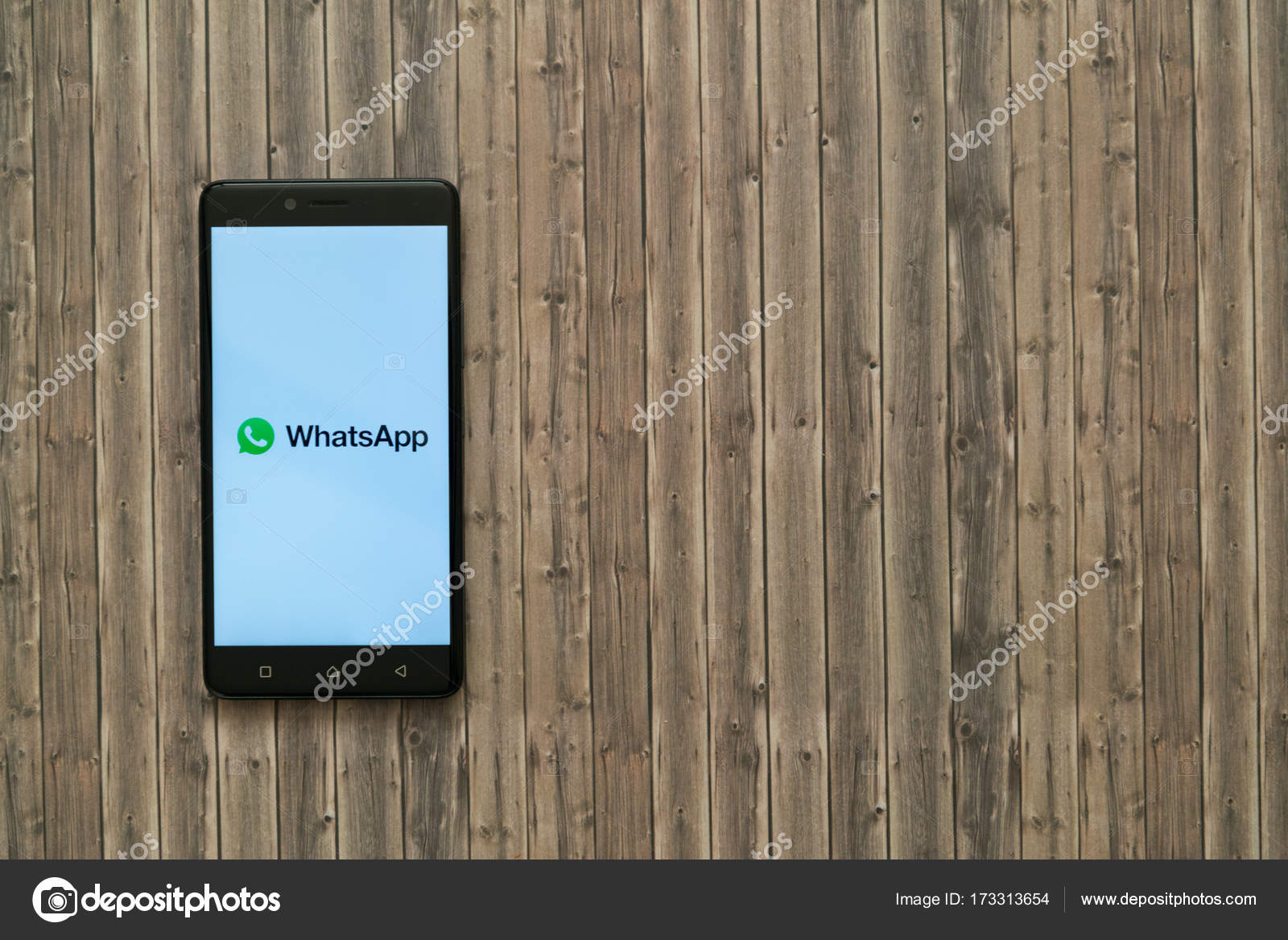 Whatsapp logo on smartphone screen on wooden background. – Stock ...