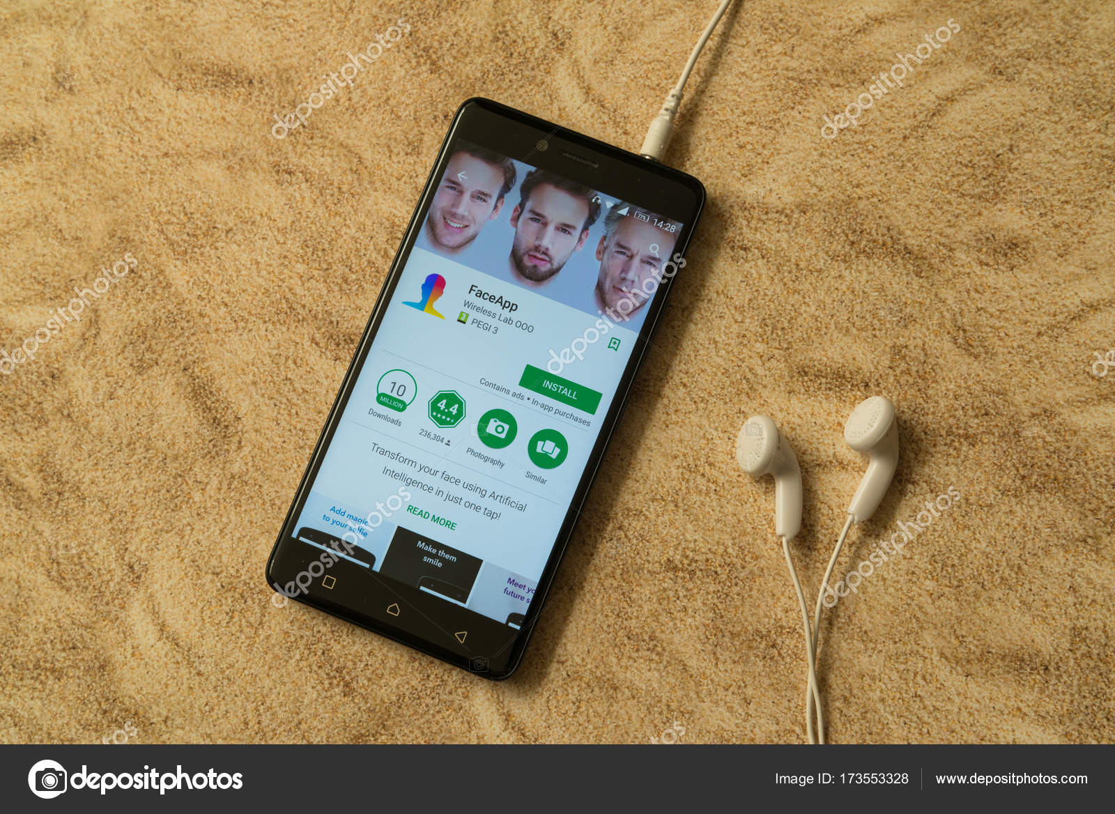 Faceapp application in google play store on sandy background and ...