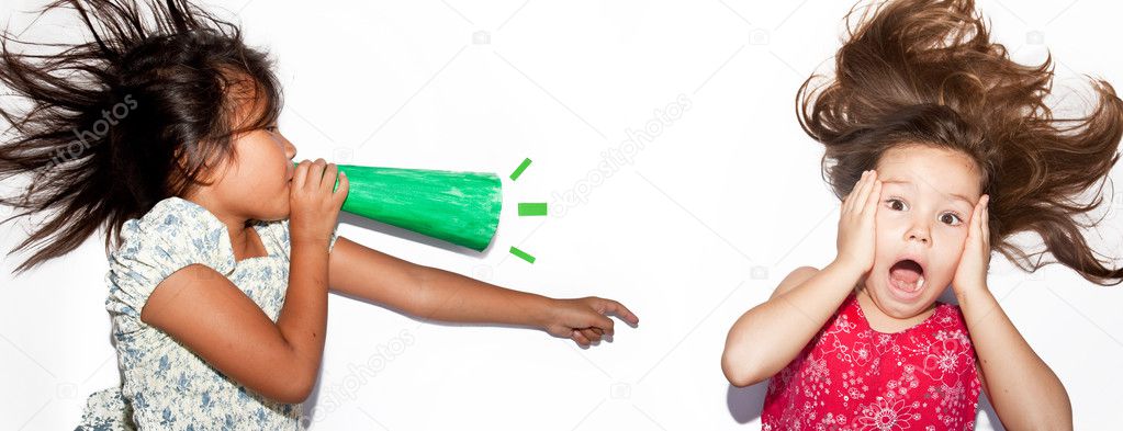 Little girl shouting at her friend Stock Photo by ©RadaRani 128160196