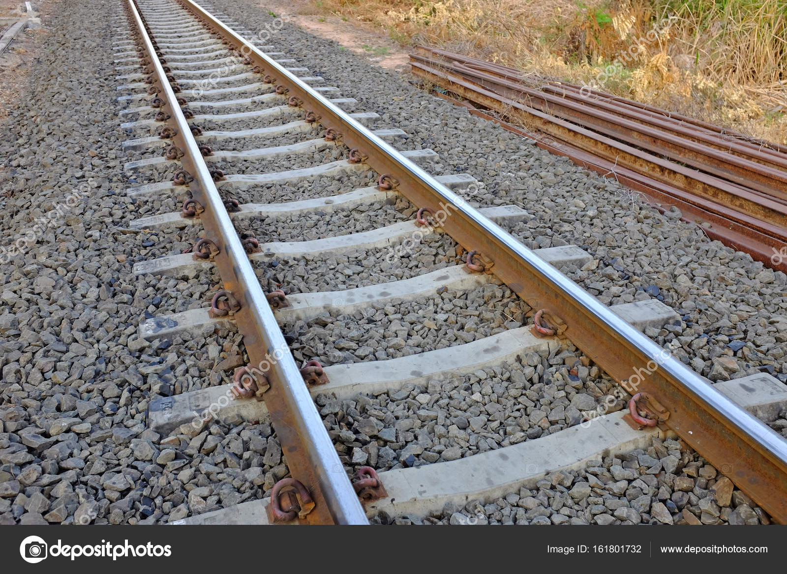 Steel support rails with concrete sleepers strewn with gravel Stock ...