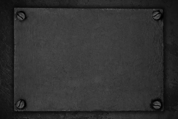 Black steel plate with screws Stock Photo by ©Miro-Novak 133571620