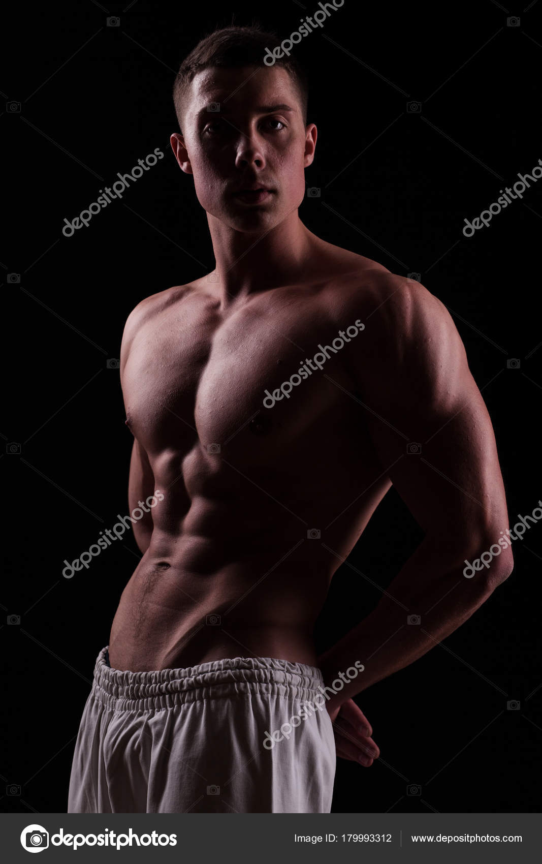 Young athlete bodybuilder man Stock Photo by ©doodko 179993312