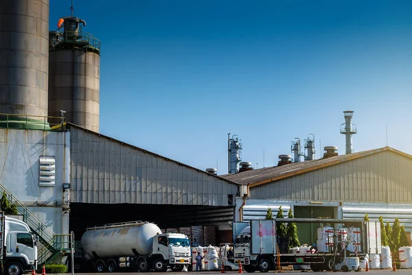 Loading plastic resins up to trucks in warehouse. - Stock Image ...