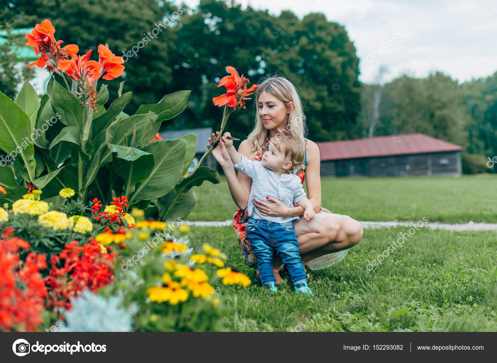 Mom and son watching flowers — Stock Photo © deniskatula #152293082