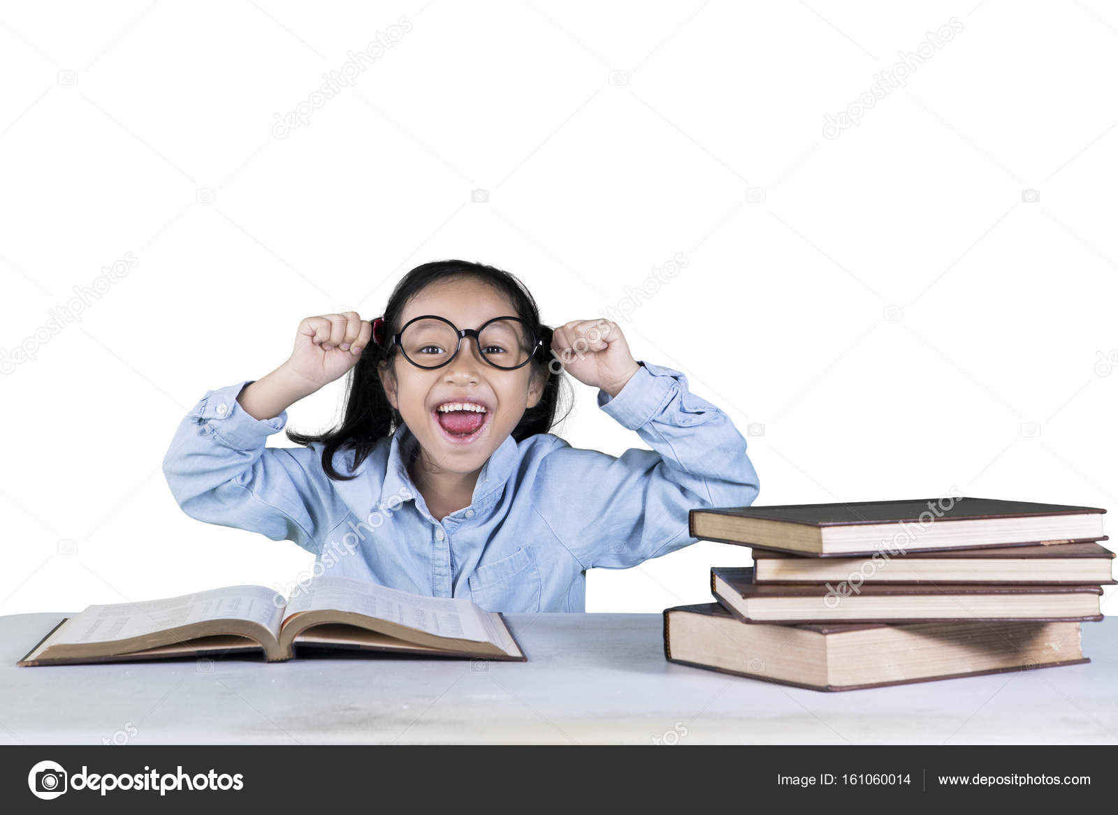Successful elementary student with books Stock Photo by ©realinemedia ...