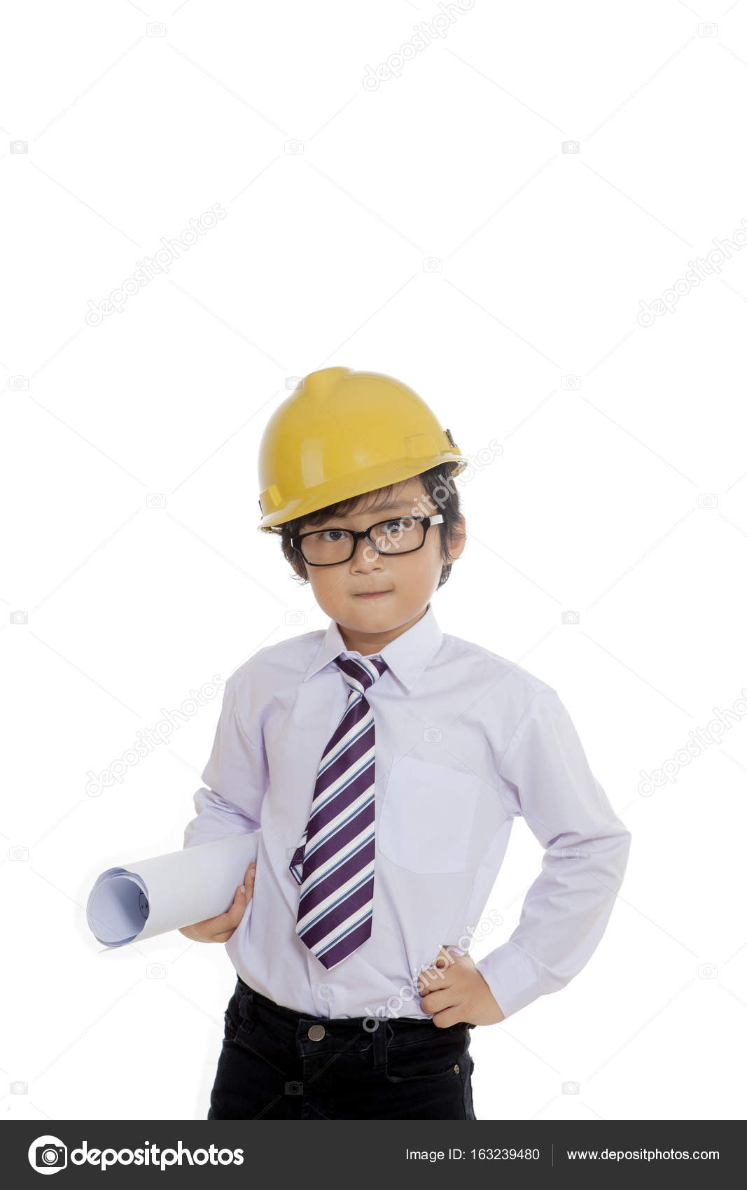 Cute boy with blueprint and helmet Stock Photo by ©realinemedia 163239480