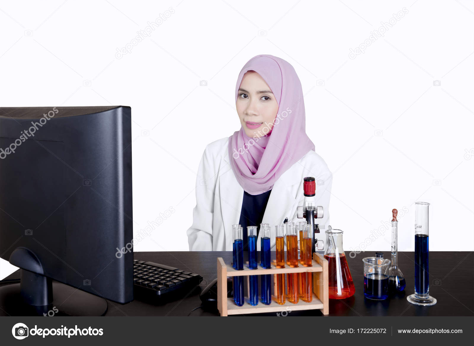 Young muslim scientist with test tube on desk Stock Photo by ...
