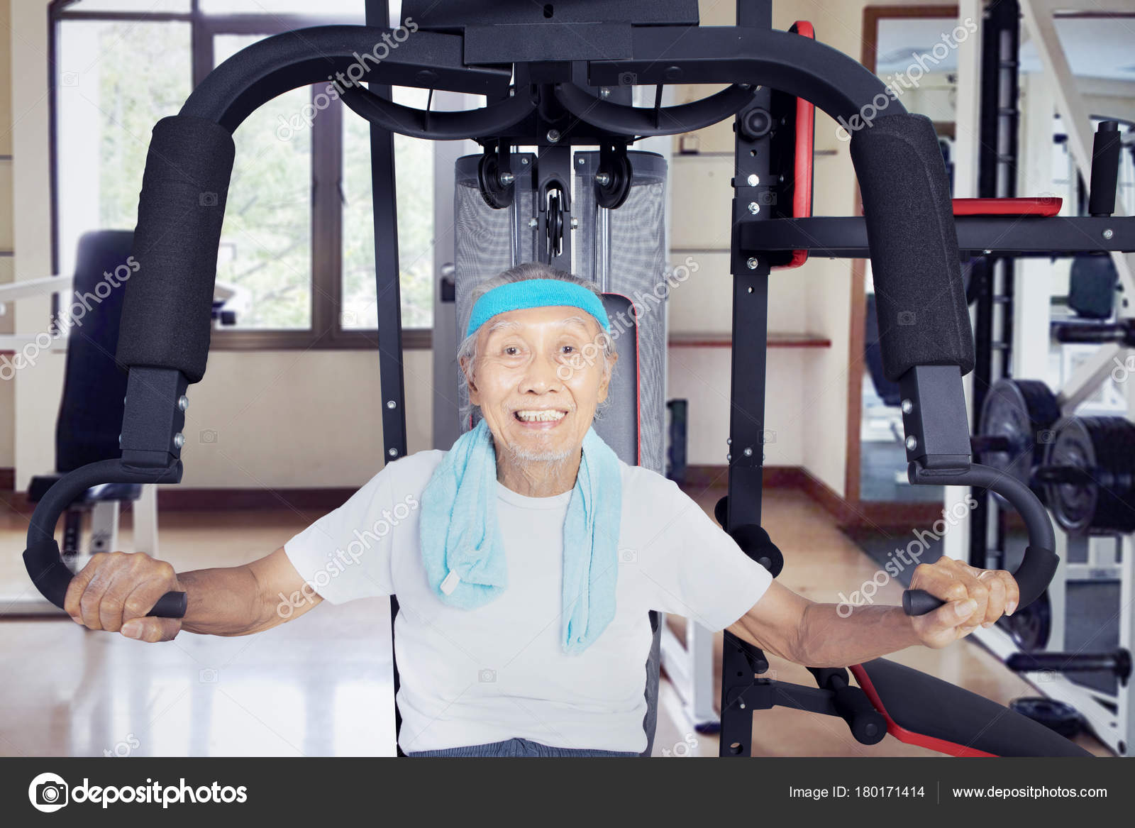 Old man doing workout with weight machine ⬇ Stock Photo, Image by ...