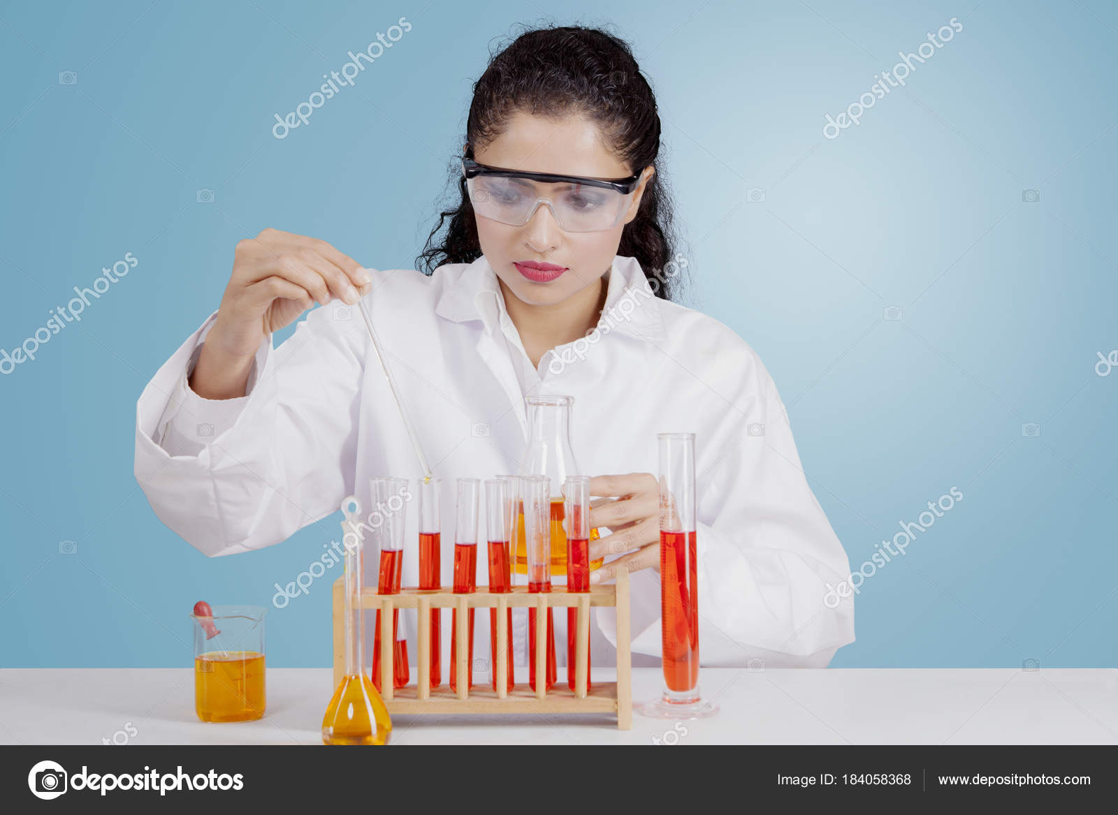 Indian scientist working with chemicals Stock Photo by ©realinemedia ...