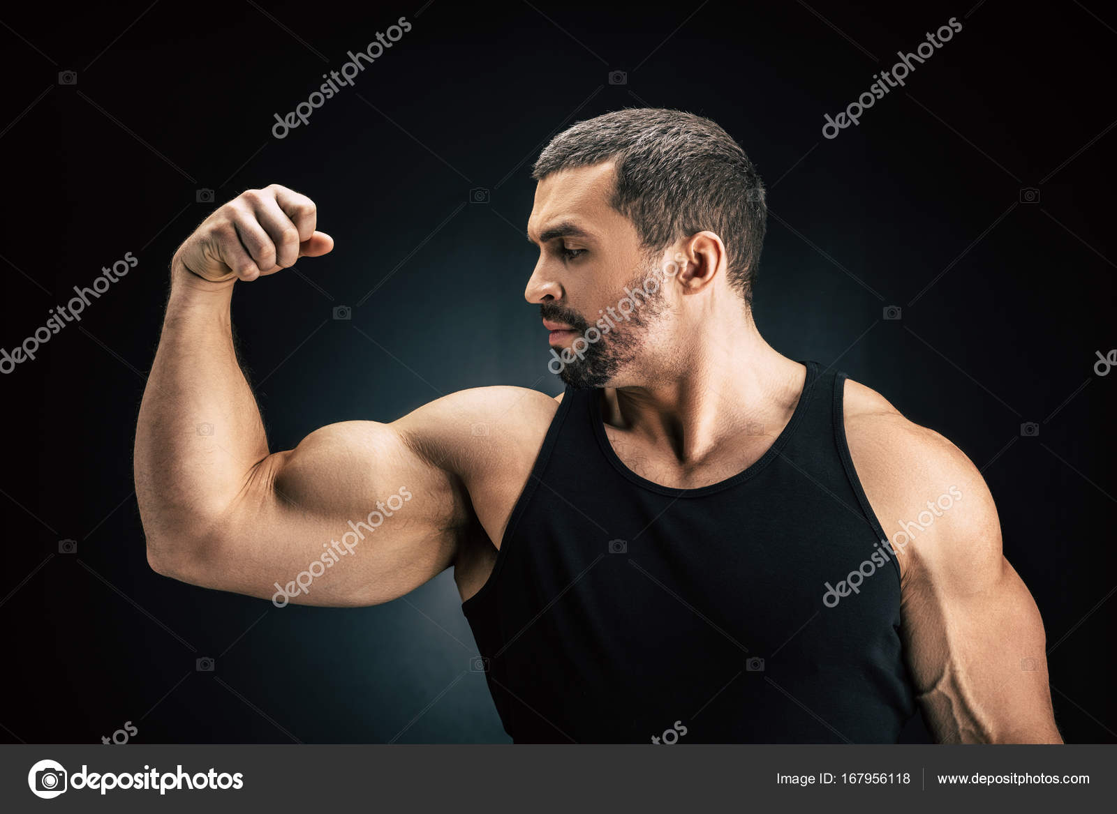 Strong man showing muscles Stock Photo by ©AlexFedorenko 167956118