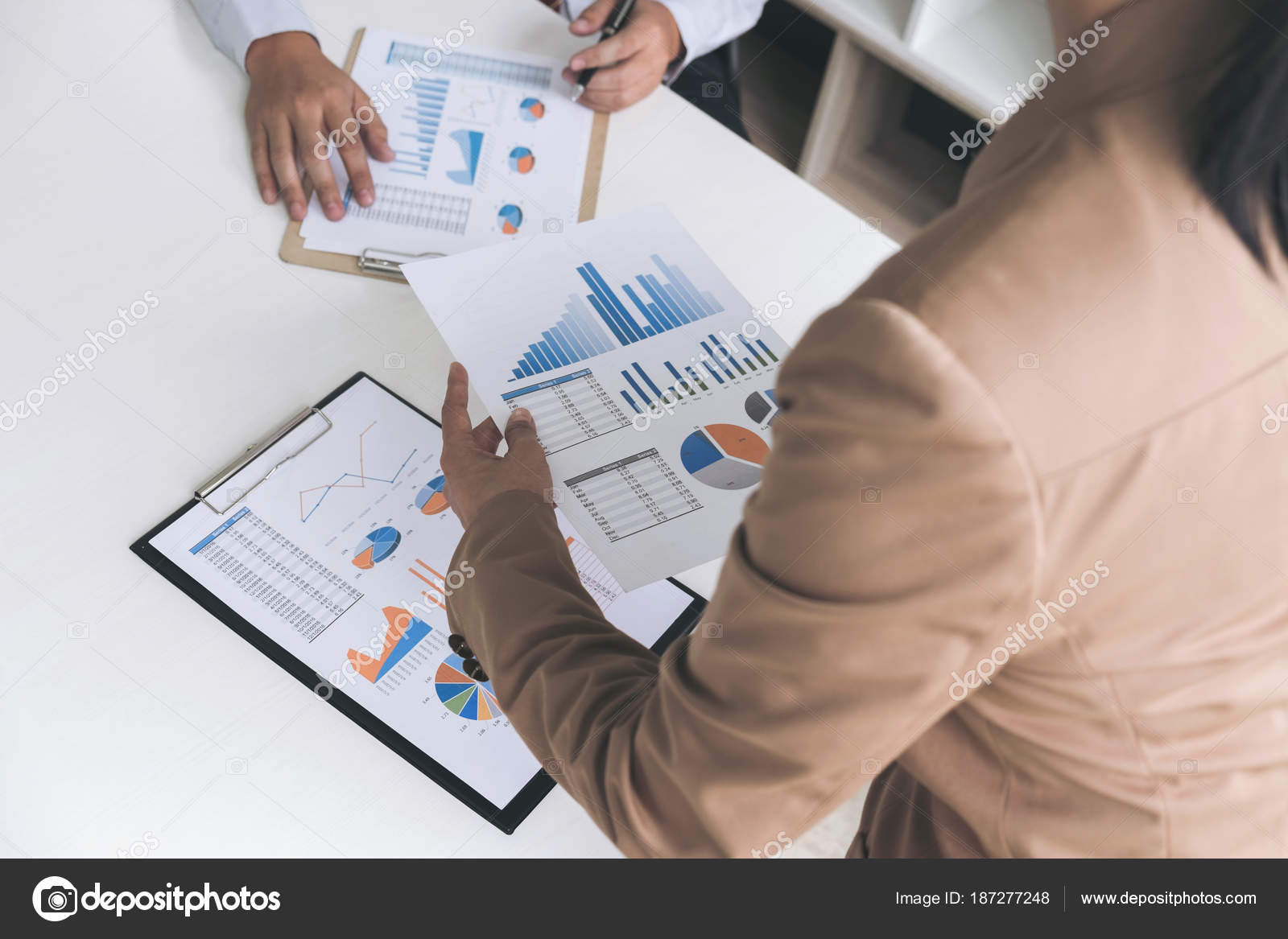 Business people discussion, Executive team discussing the charts ...