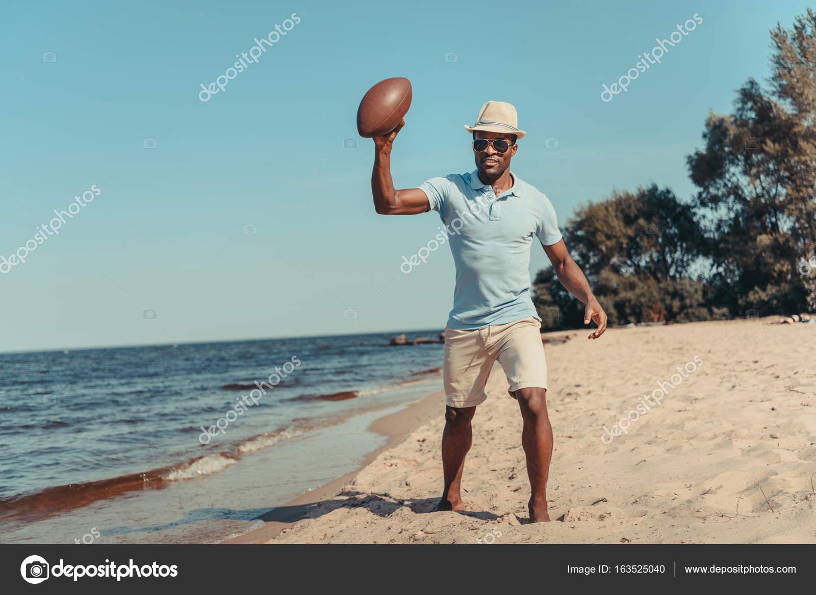 African american man with rugby ball — Stock Photo © AlexNazaruk #163525040