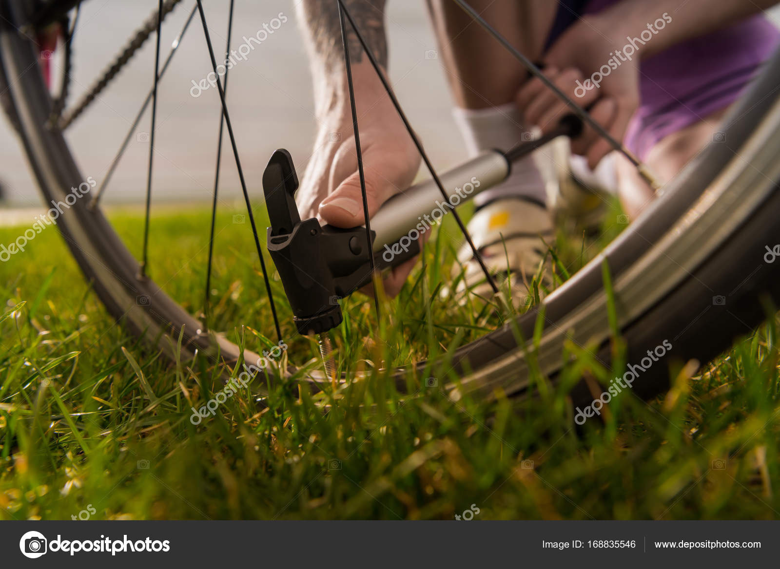 Man pumping bicycle wheel — Stock Photo © AlexNazaruk #168835546