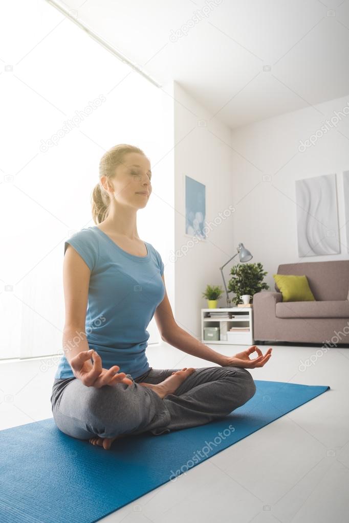 Woman in lotus position — Stock Photo © stokkete #125212388