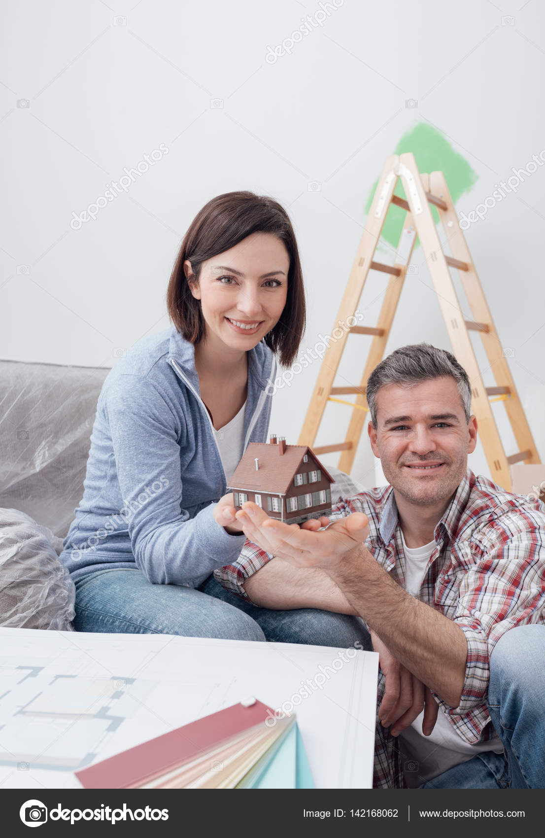 Couple building dream house Stock Photo by ©stokkete 142168062