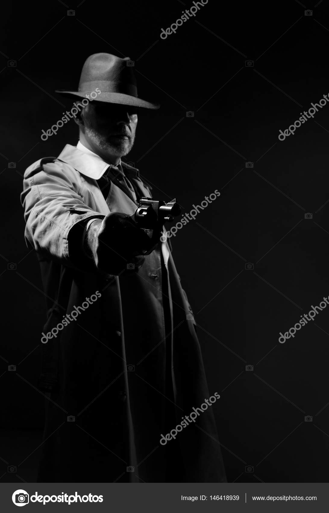 Spy agent pointing gun in dark — Stock Photo © stokkete #146418939