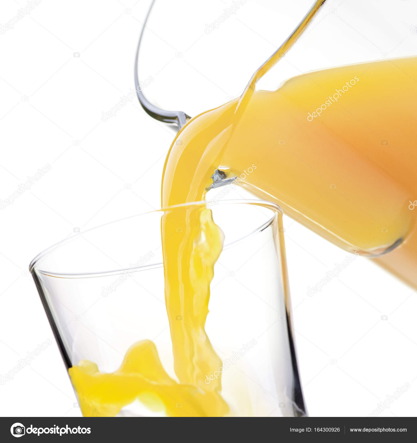 Pouring refreshing juice in glass — Stock Photo © stokkete #164300926