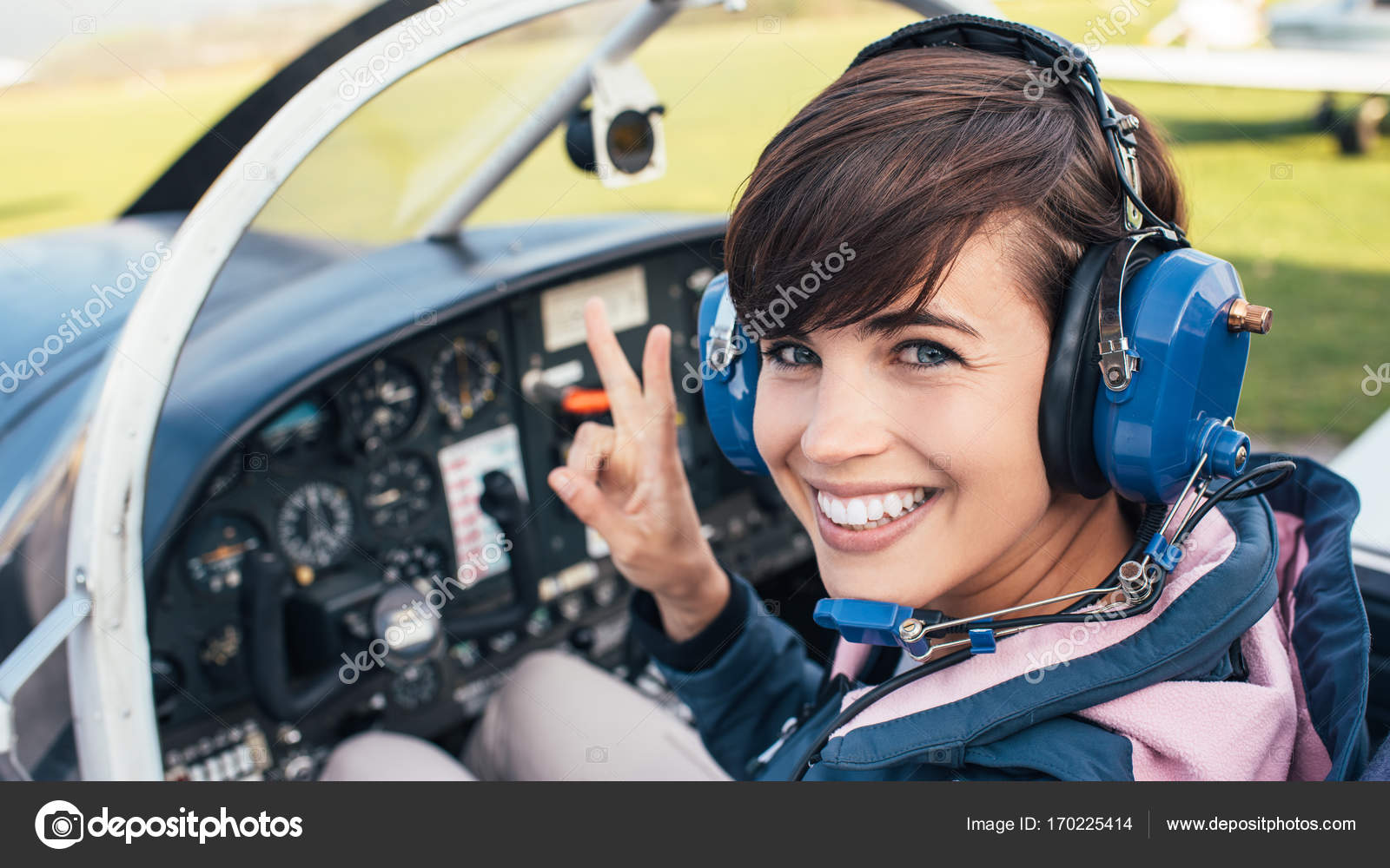 Female pilot in aircraft cockpit Stock Photo by ©stokkete 170225414