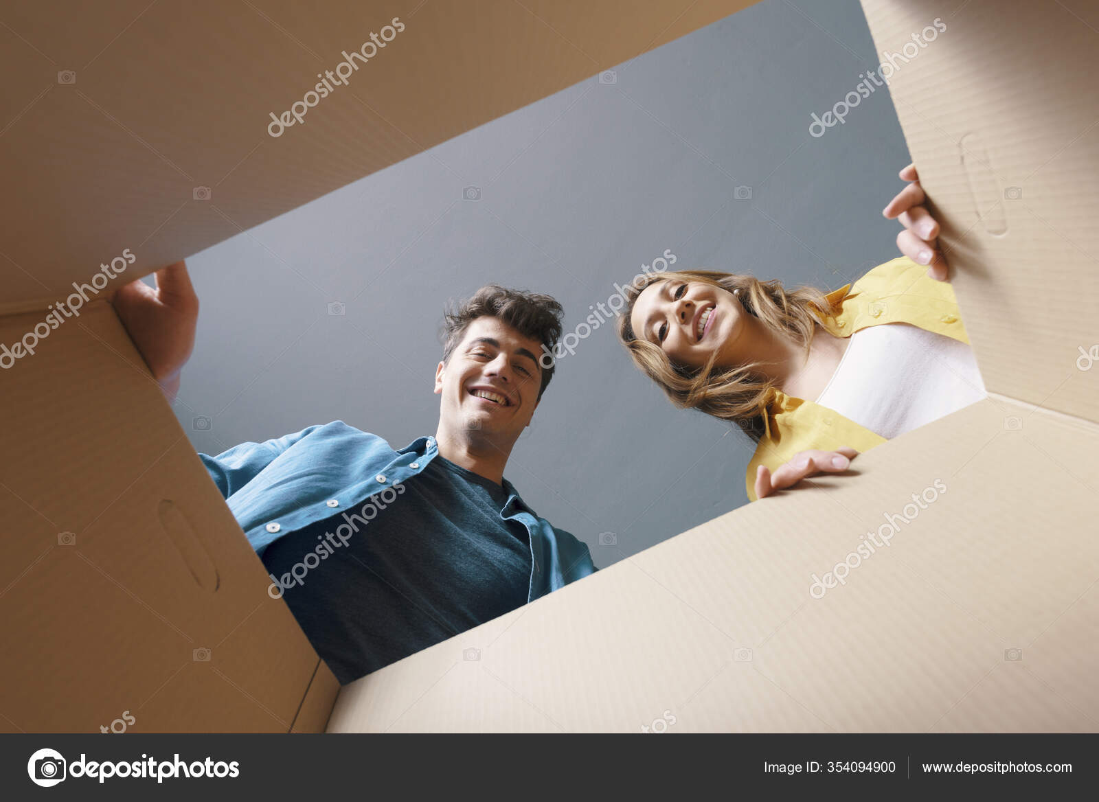 Happy Couple Opening Cardboard Box Looking Smiling Cheerful Stock Photo ...